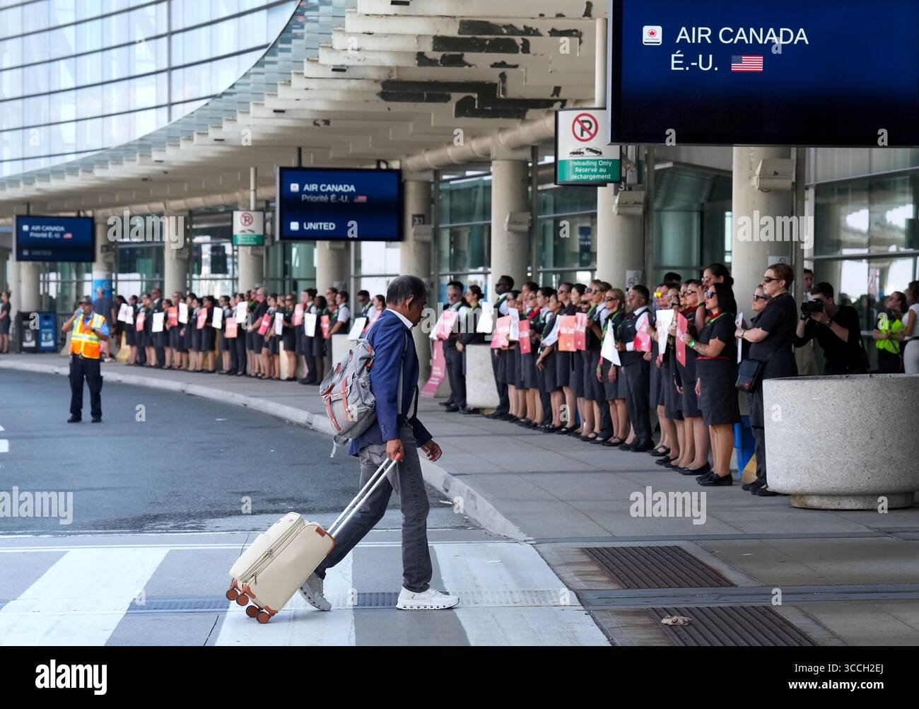 Air Canada flight attendants gather for a demonstration in preparation ...