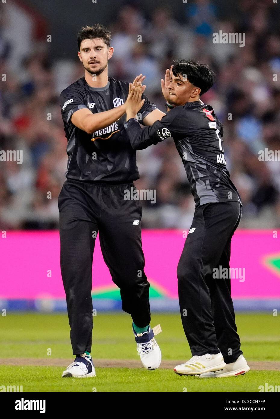 Manchester Originals' Josh Tongue (left) celebrates with Farhan Ahmed ...