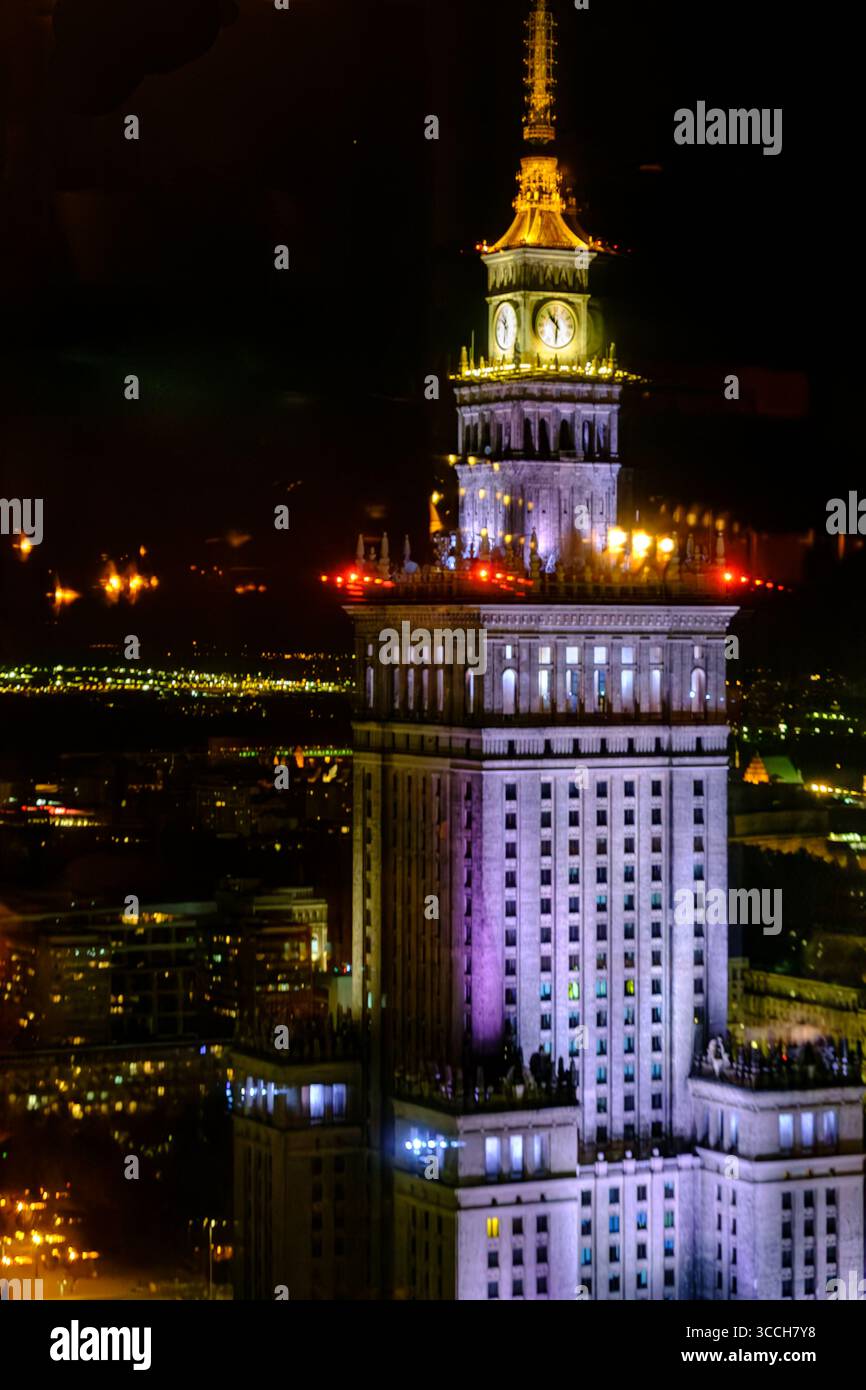 The imposing Palace of Culture and Science illuminated at night, its ...
