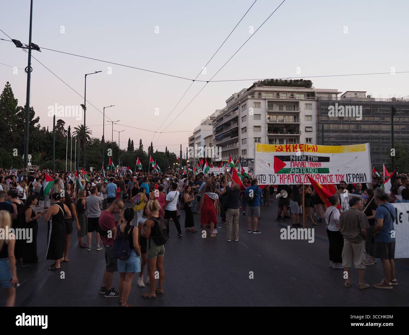 Walking crowd holding flag building exterior architecture hi-res stock ...