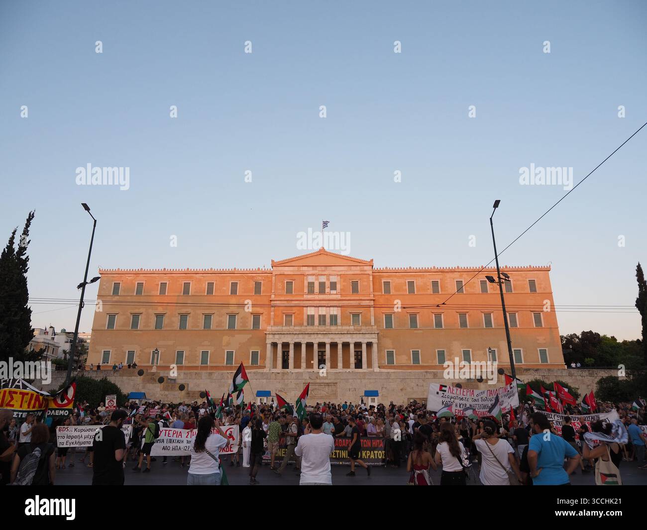 Athens, Greece - August 10 2025: Crowd demonstrating in front of orange ...