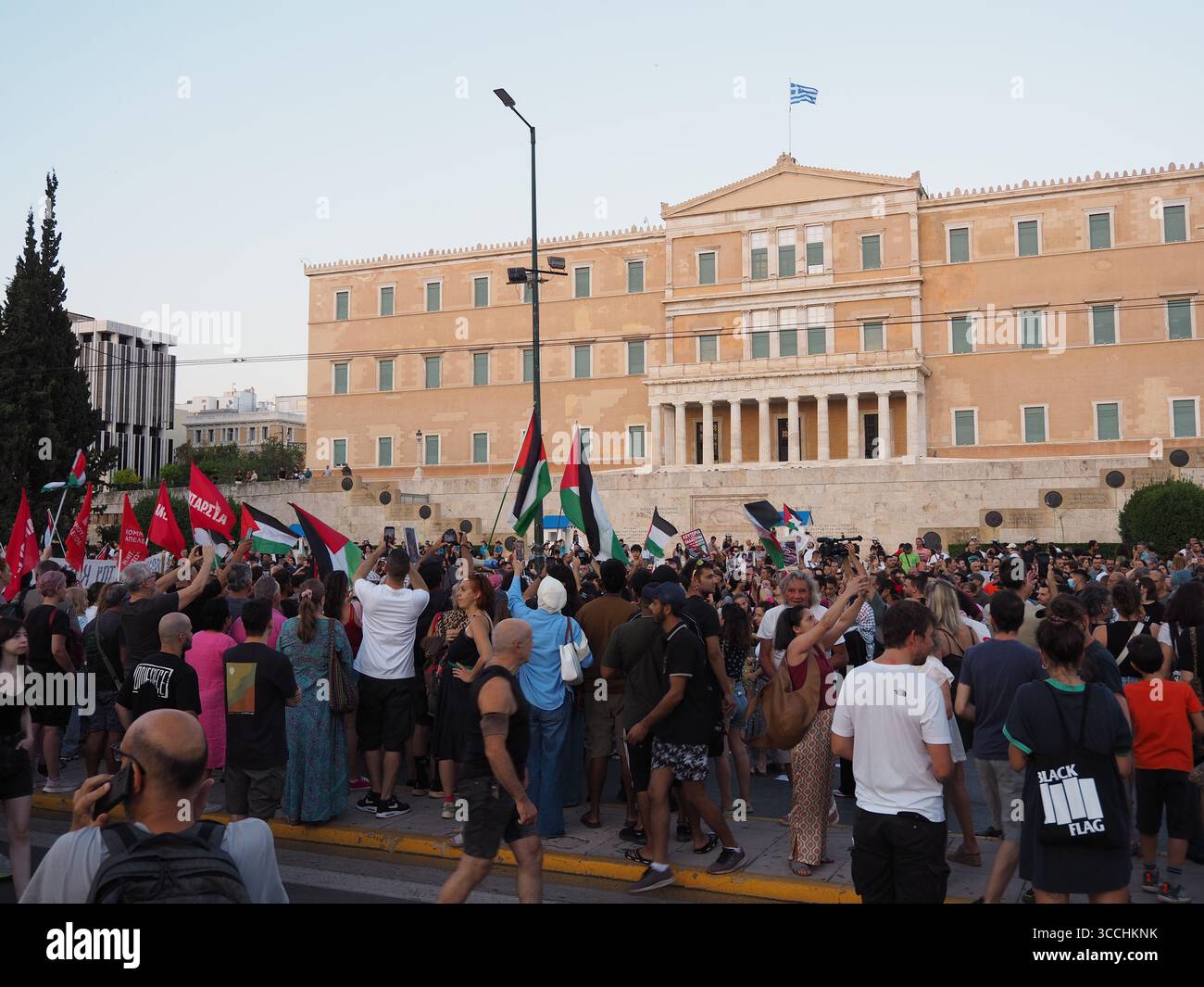 Crowd social issues holding banner building exterior hi-res stock ...