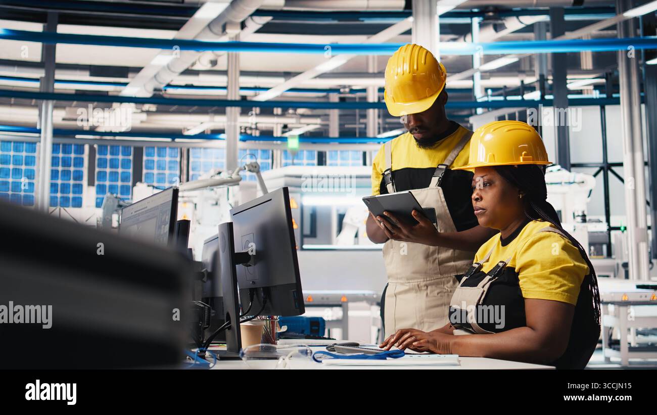 African american team of employees doing quality control on pc ...