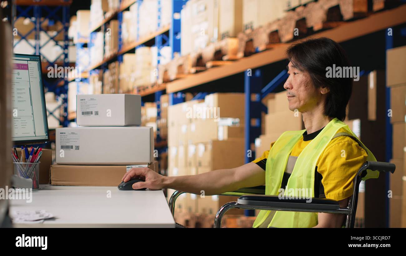 Asian man wheelchair user typing hi-res stock photography and images ...