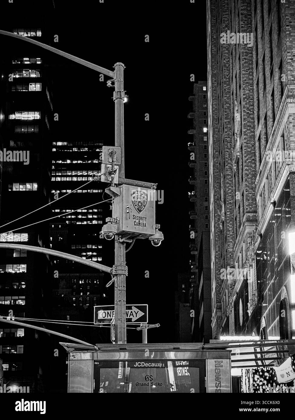 Street signs and traffic signals at a Manhattan intersection ...
