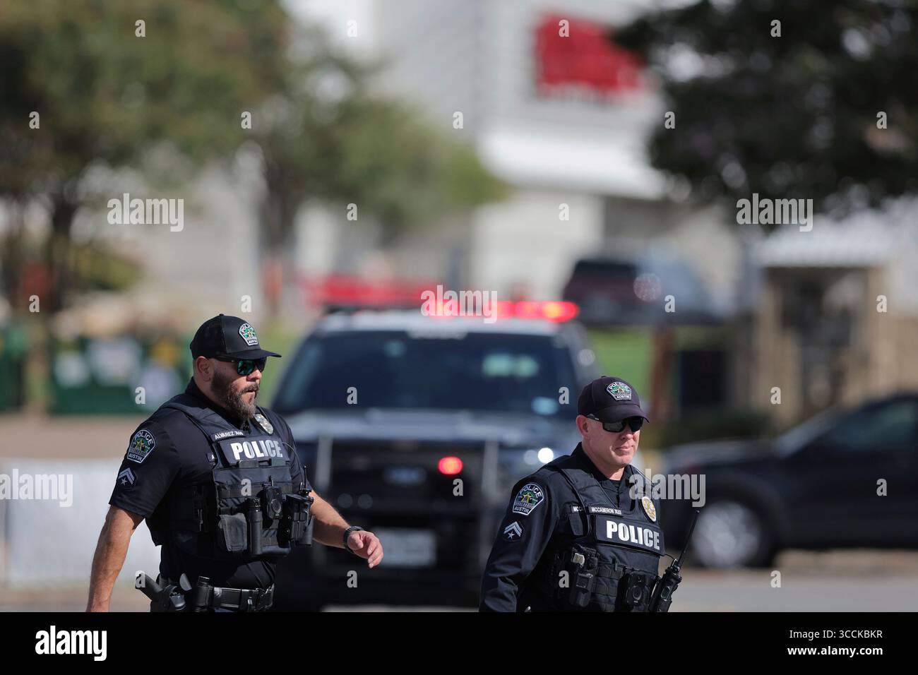 Police monitor the scene near a Target after a shooting in Austin ...