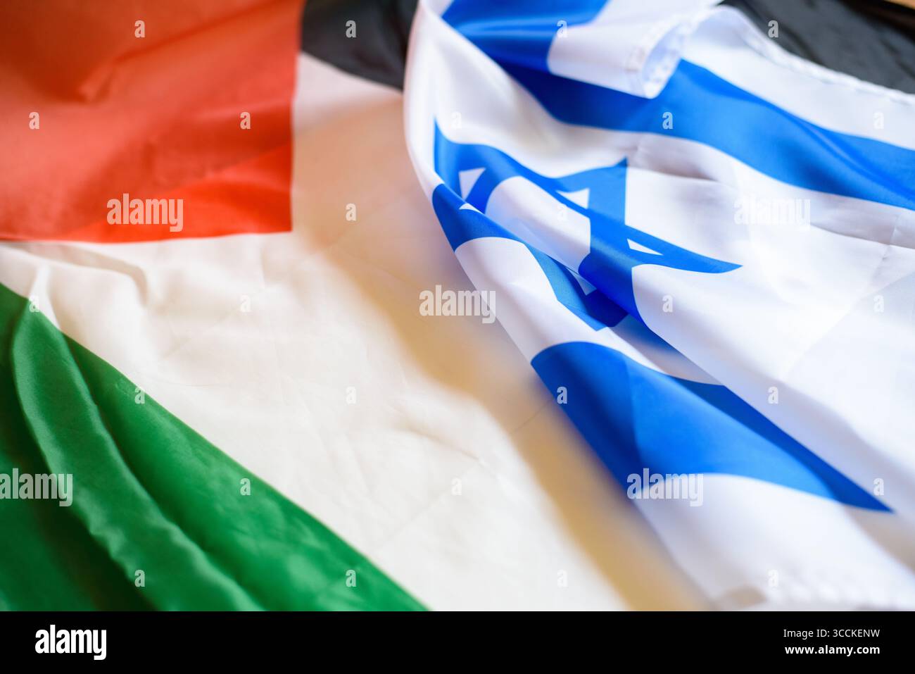 The intertwined flags of Israel and Palestine reflect the complex and ...