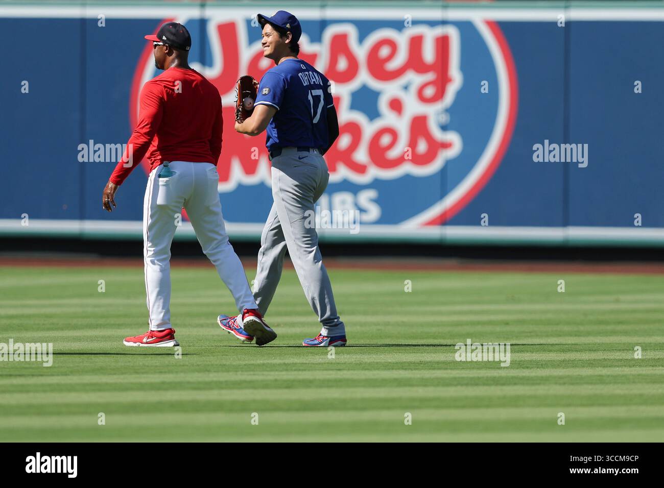 Los Angeles Dodgers' Shohei Ohtani (17) reacts while interacting with ...