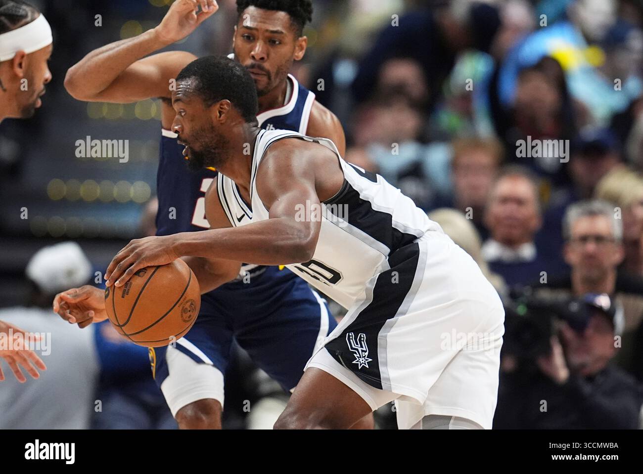 San Antonio Spurs forward Harrison Barnes (40) drives past Denver ...