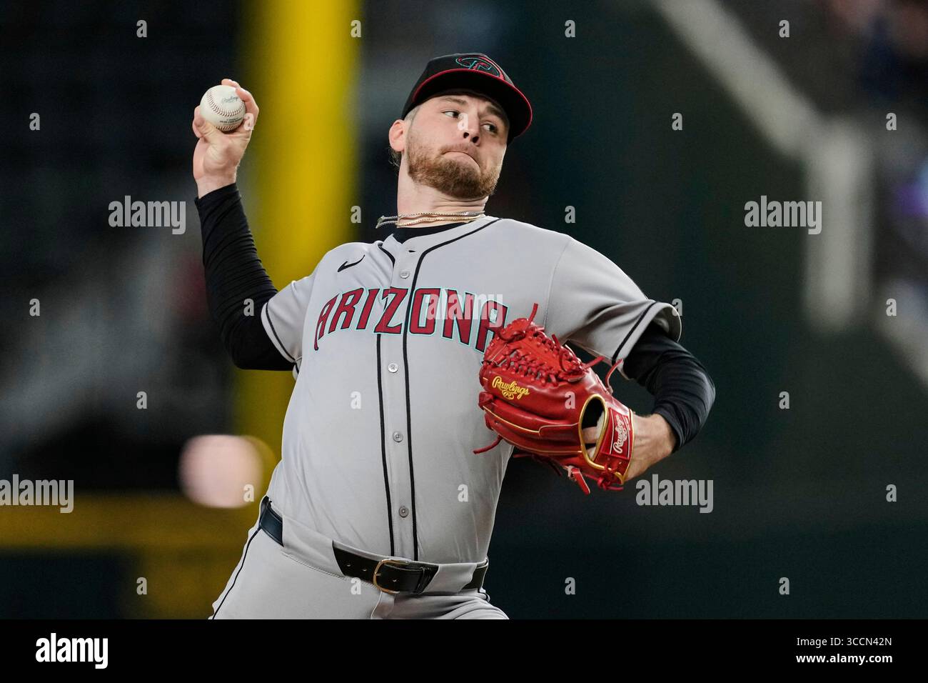Arizona Diamondbacks starting pitcher Ryne Nelson throws to the Texas Rangers in the first ...