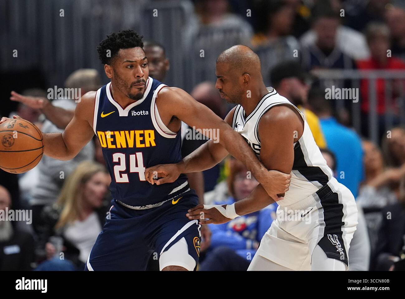 Denver Nuggets guard Jalen Pickett (24) and San Antonio Spurs guard ...