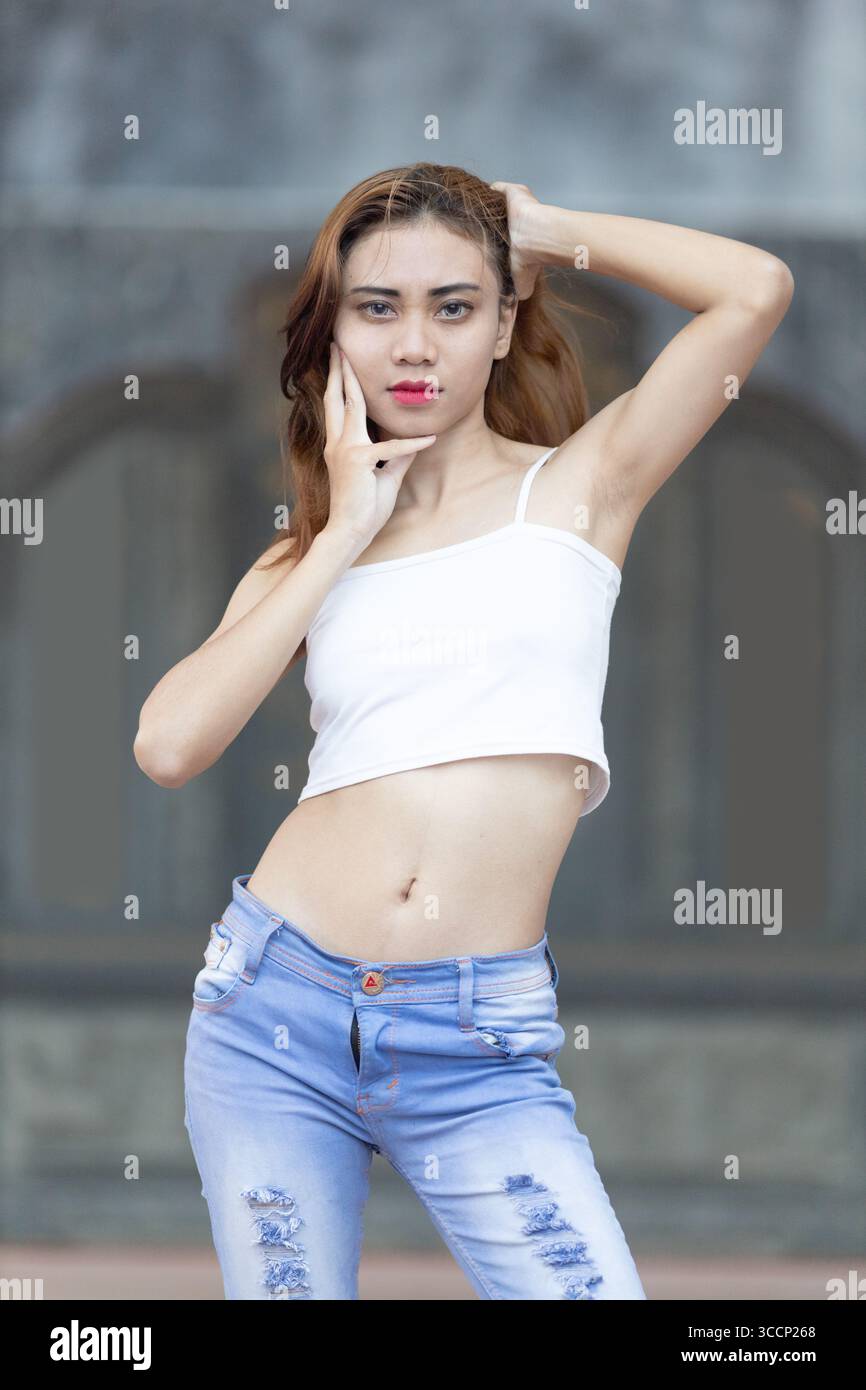 This fashion-forward image features a stylish individual posing with ...