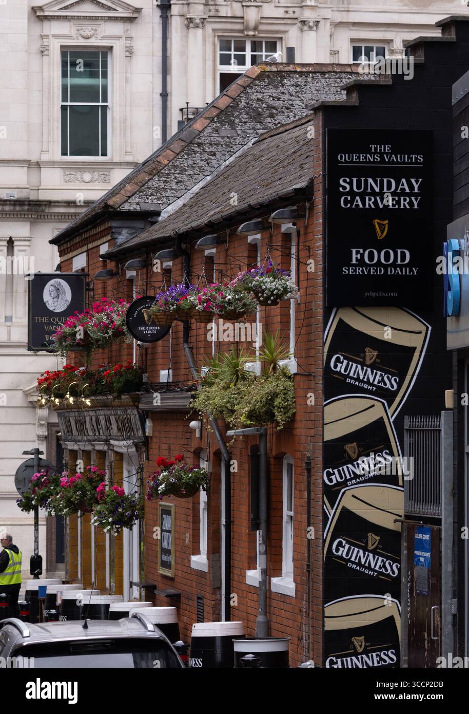 CARDIFF, UK - AUGUST 8, 2025 - Traditional pub The Queens Vaults with ...