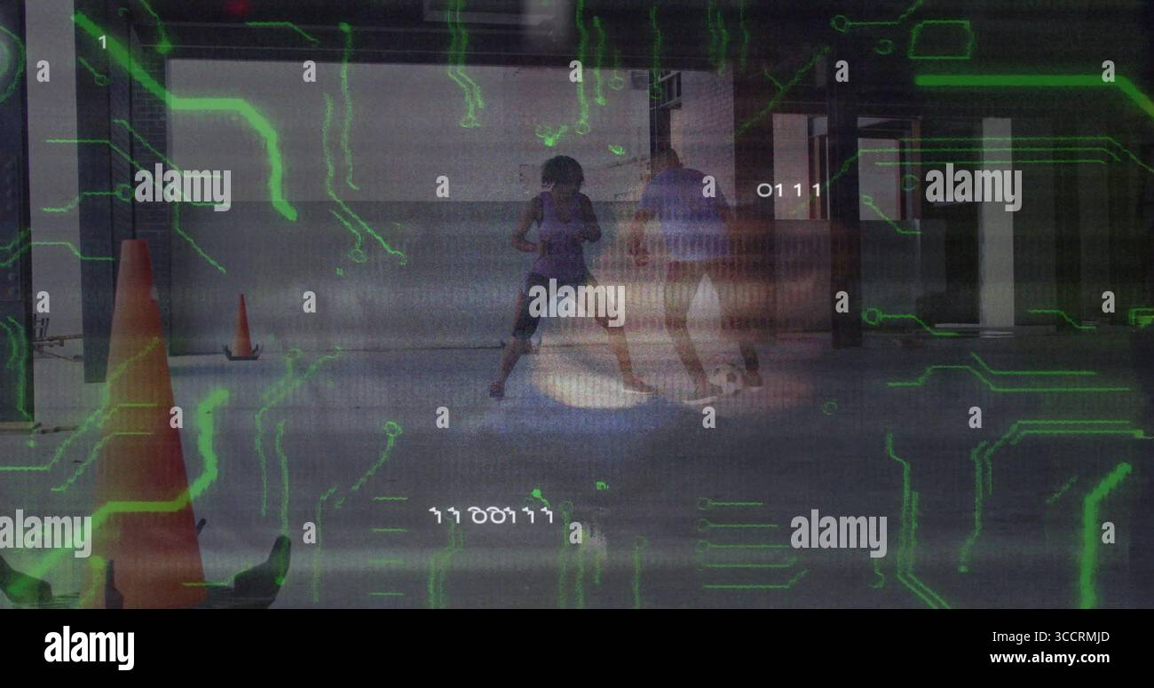 Practicing martial arts trainees sparring in garage, with cones and ...