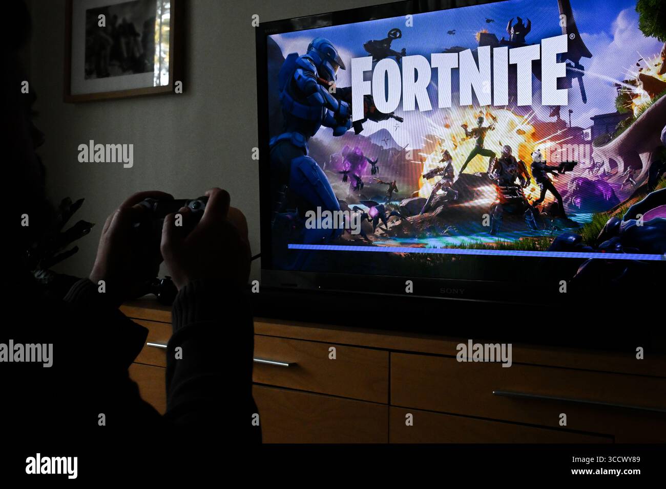 General view of a gamer playing Epic Games’ Fortnight on a Playstation ...