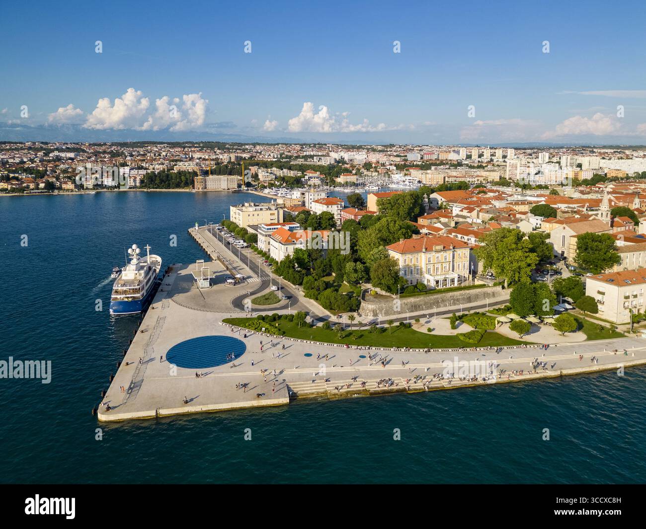 Aerial view of the vibrant waterfront promenade and the iconic Sun ...