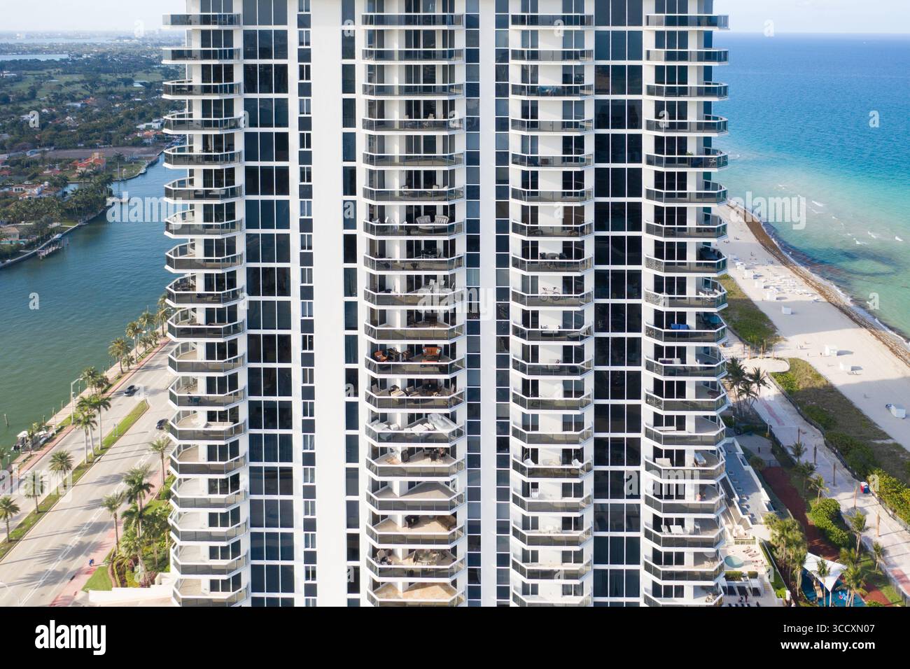 Aerial view of a modern high-rise building stands tall against the ...