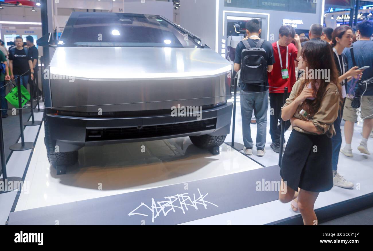 SHANGHAI, CHINA - JULY 26, 2025 - Visitors visit TESLA's booth at the ...