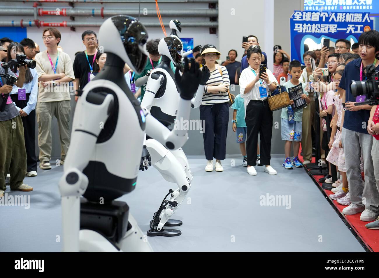 (250812) -- BEIJING, Aug. 12, 2025 (Xinhua) -- Humanoid robots perform ...