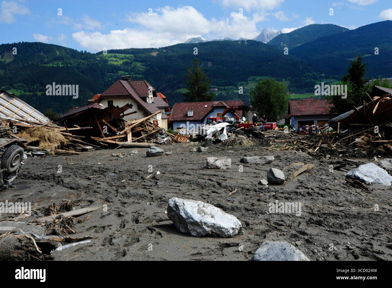 storm damage caused by mudslides, debris and mud after heavy rainfalls ...