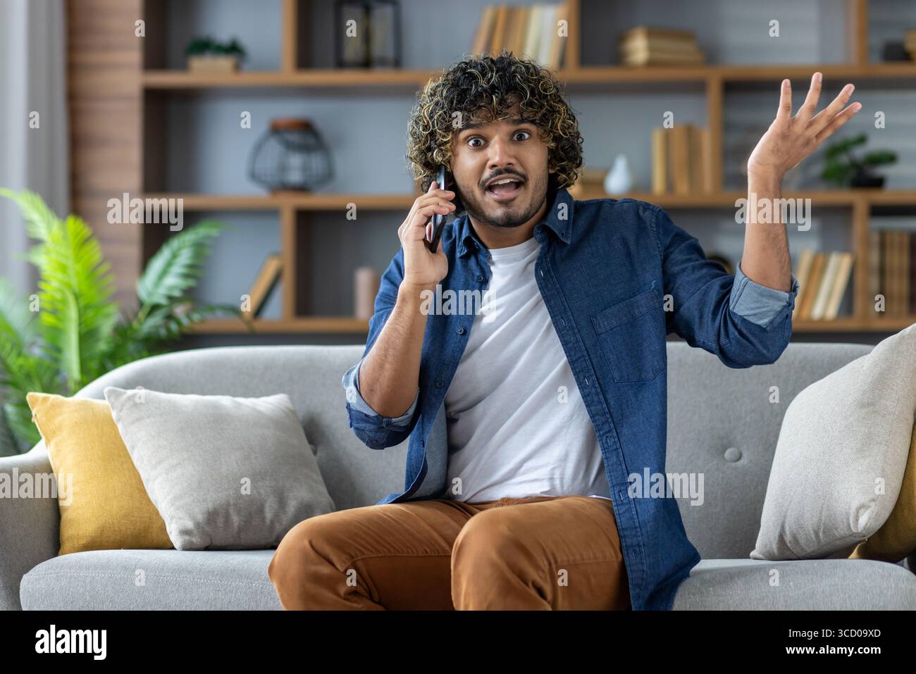 Young hispanic man gestures speaking hi-res stock photography and ...