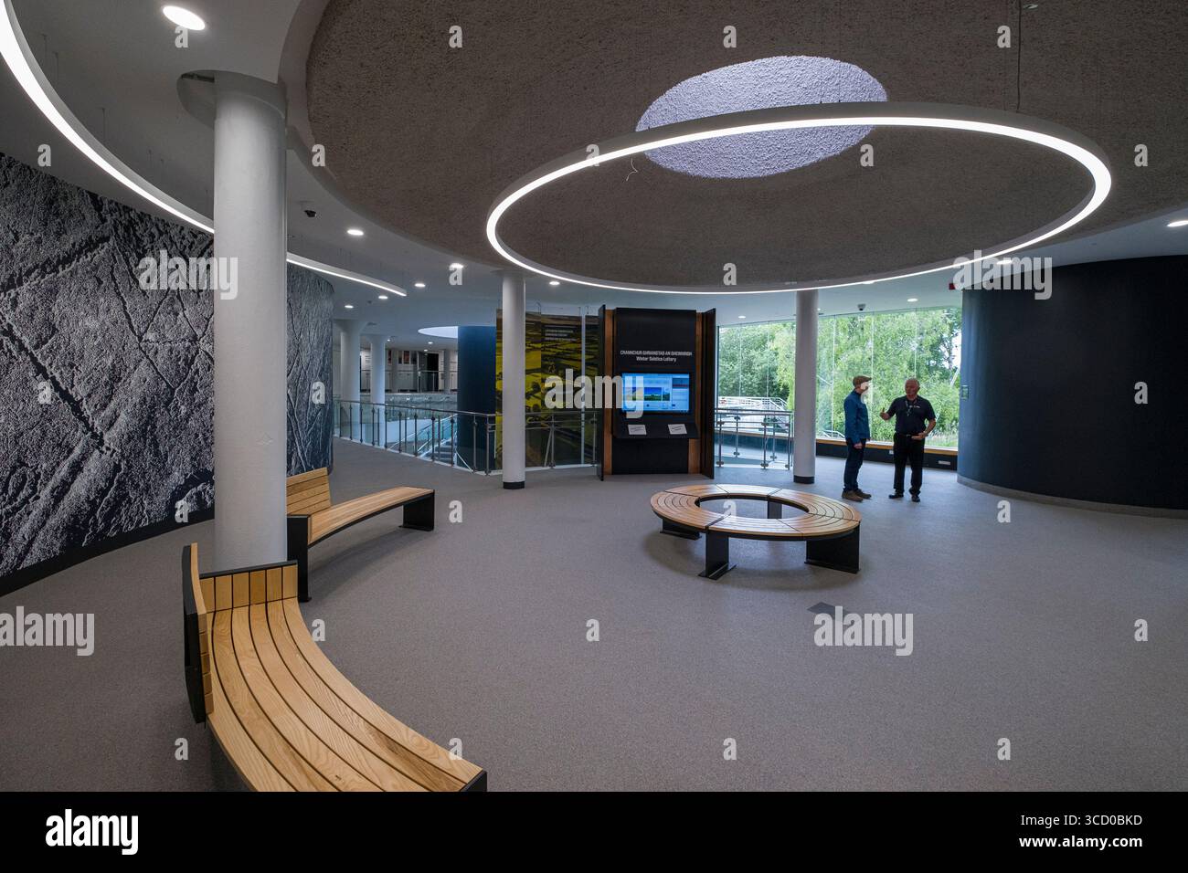 Two men standing in the lobby of the Brú na Bóinne, Newgrange and ...