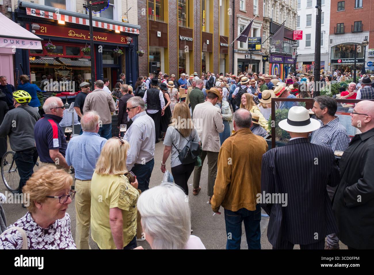 Crowd of people standing outside Davy Byrnes during the Bloomsday ...
