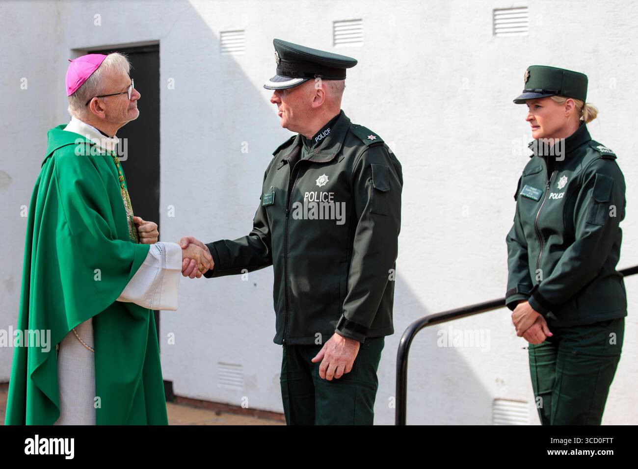 Bishop Alan McGuckian (left) thanking Police Service for Northern ...