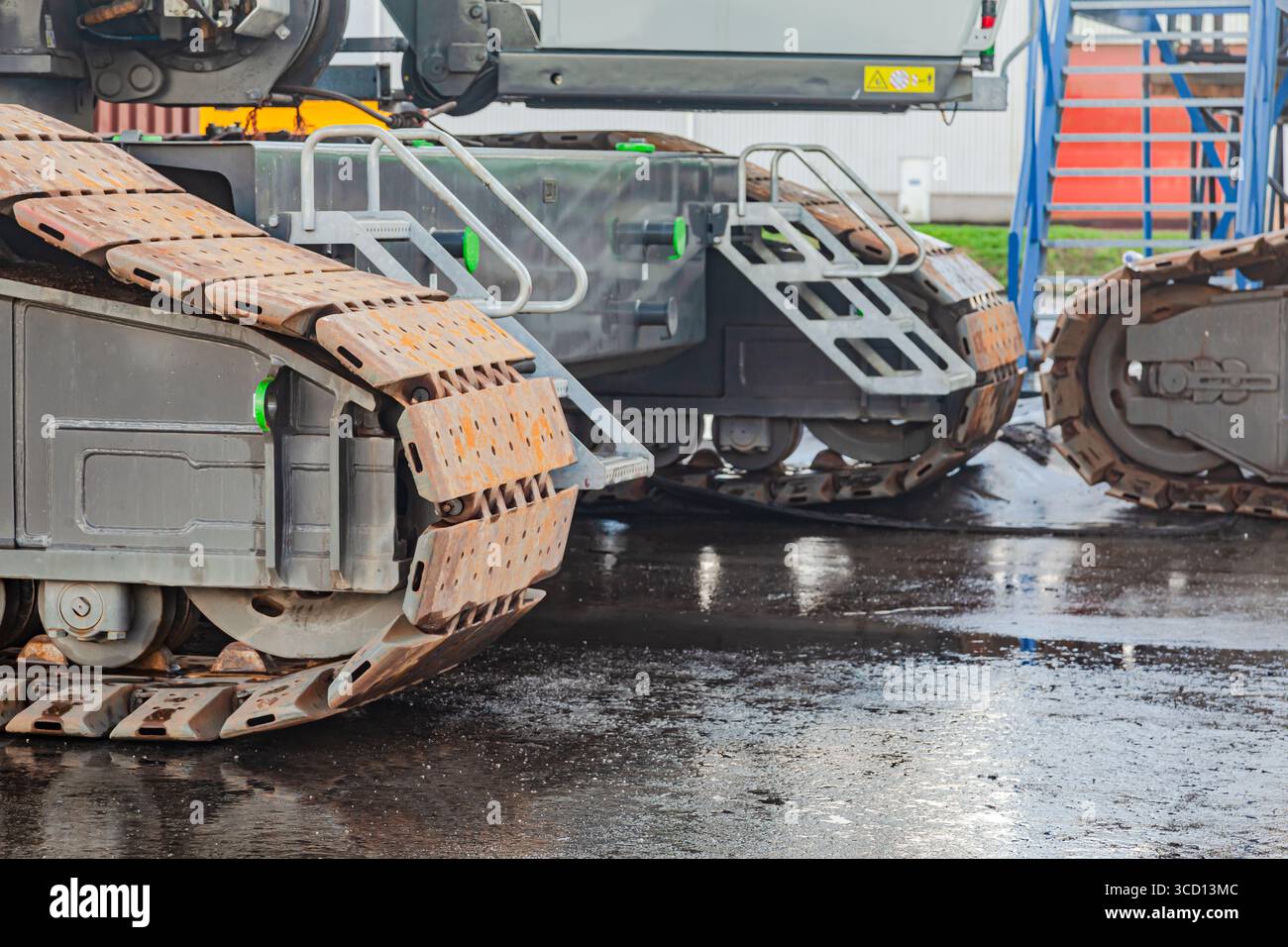 Metal tracks of a crawler cranes with steel wheels. Chassis tracked ...