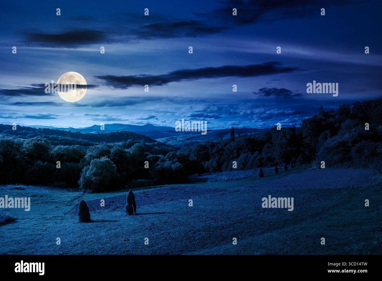 countryside landscape on september night. village in the valley and ...