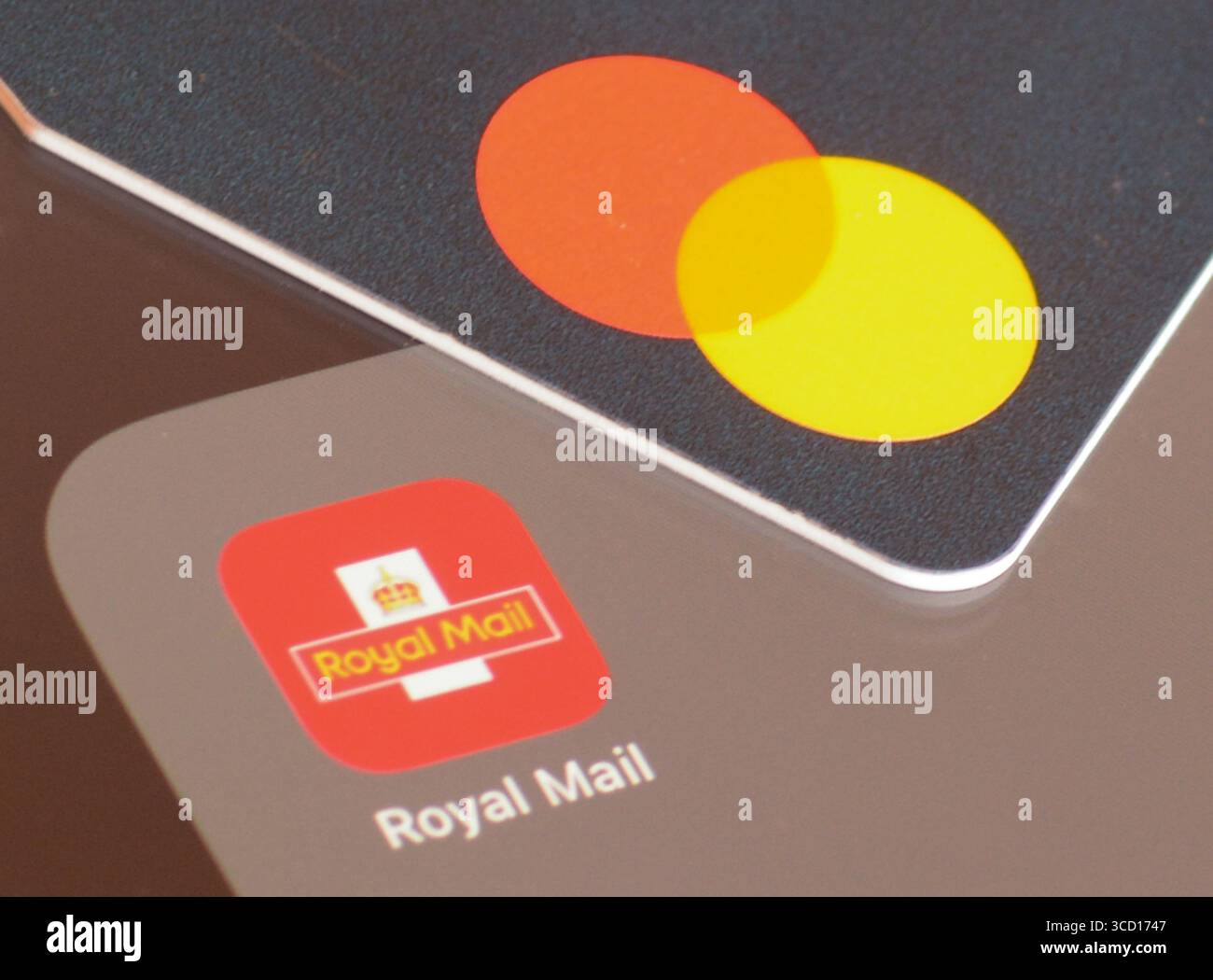 Royal Mail app on smartphone screen with a Mastercard to make payment ...