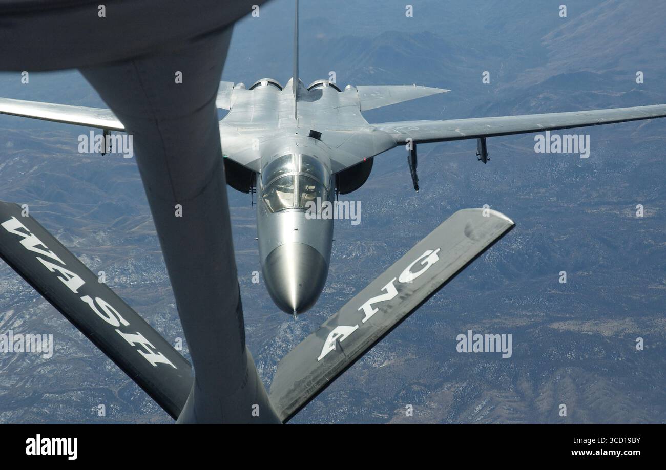 A Royal Australian Air Force F-111 approaches the refueling boom of a U ...
