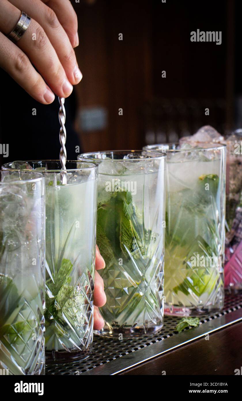 Bartender stirring cocktails in hi-res stock photography and images - Alamy