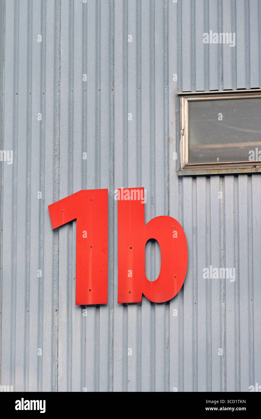 Big Red Sign One Bee 1b at Corrugated Metal Hall Building Stock Photo ...