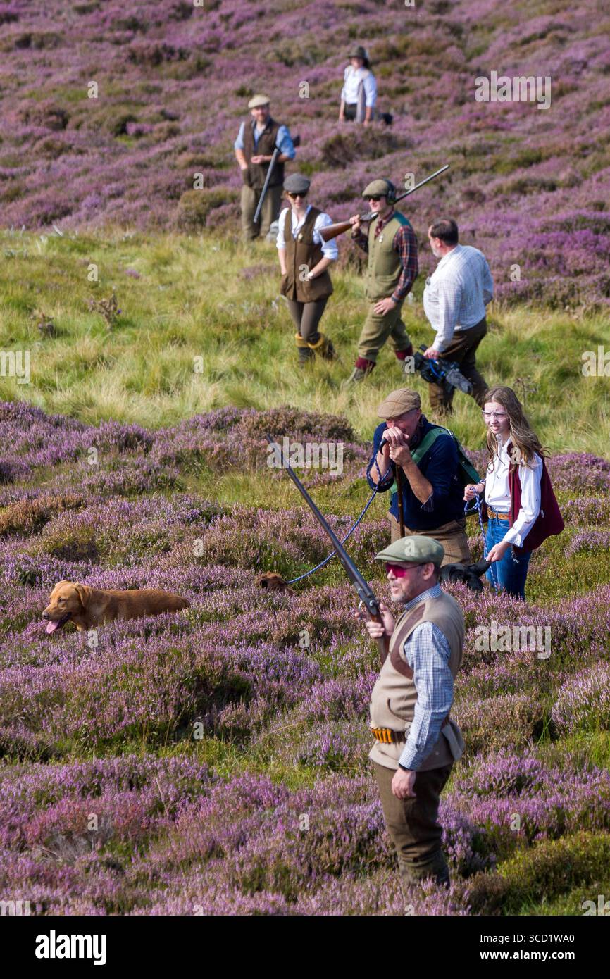 Members of a shooting party on the moors at the West Glenalmond Estate ...