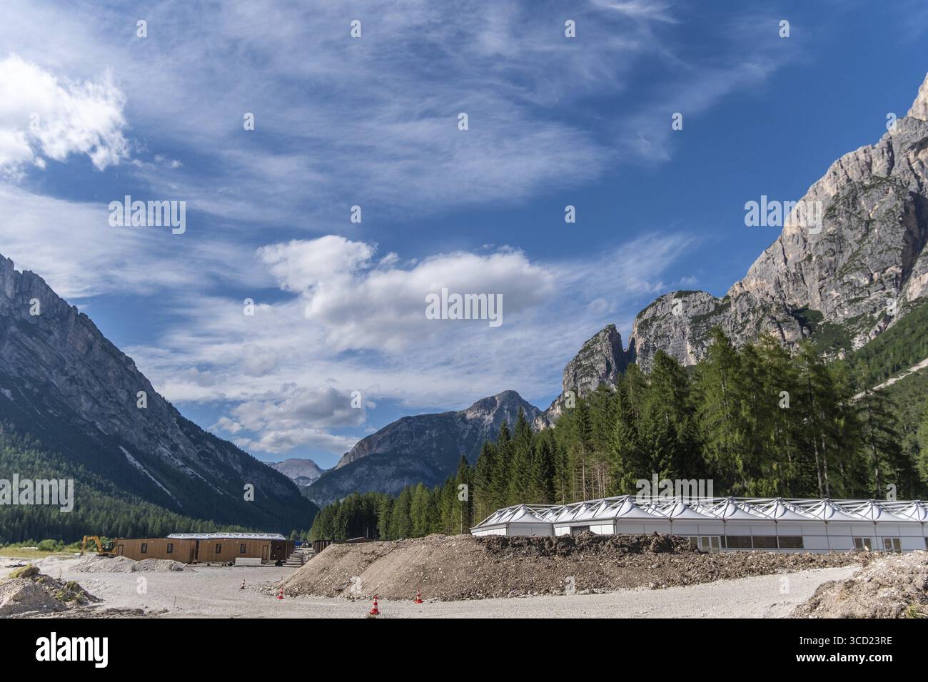 Construction site with timber and tent structures in the Dolomites ...