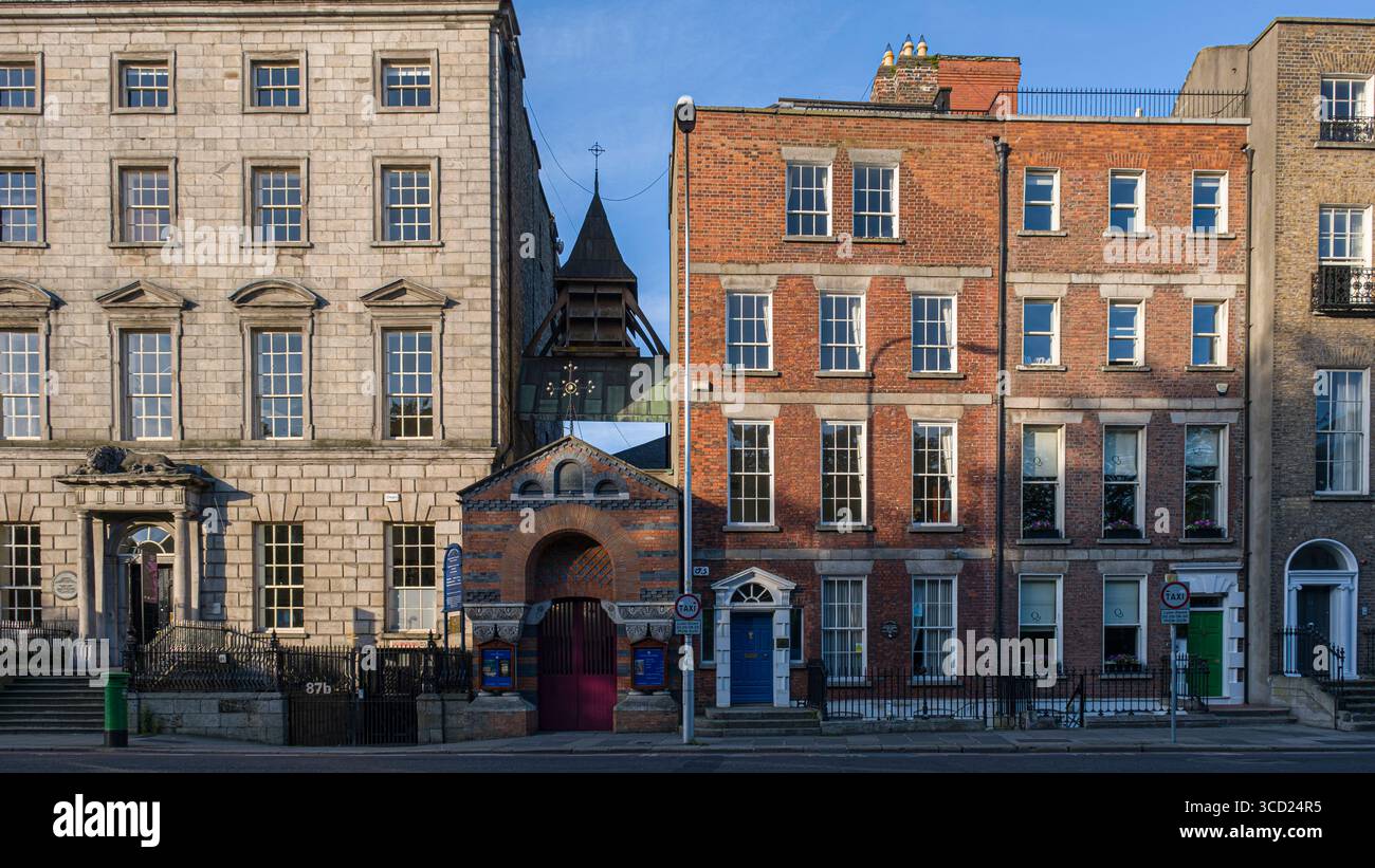 Newman University Church squeezed between two apartment buildings, St ...