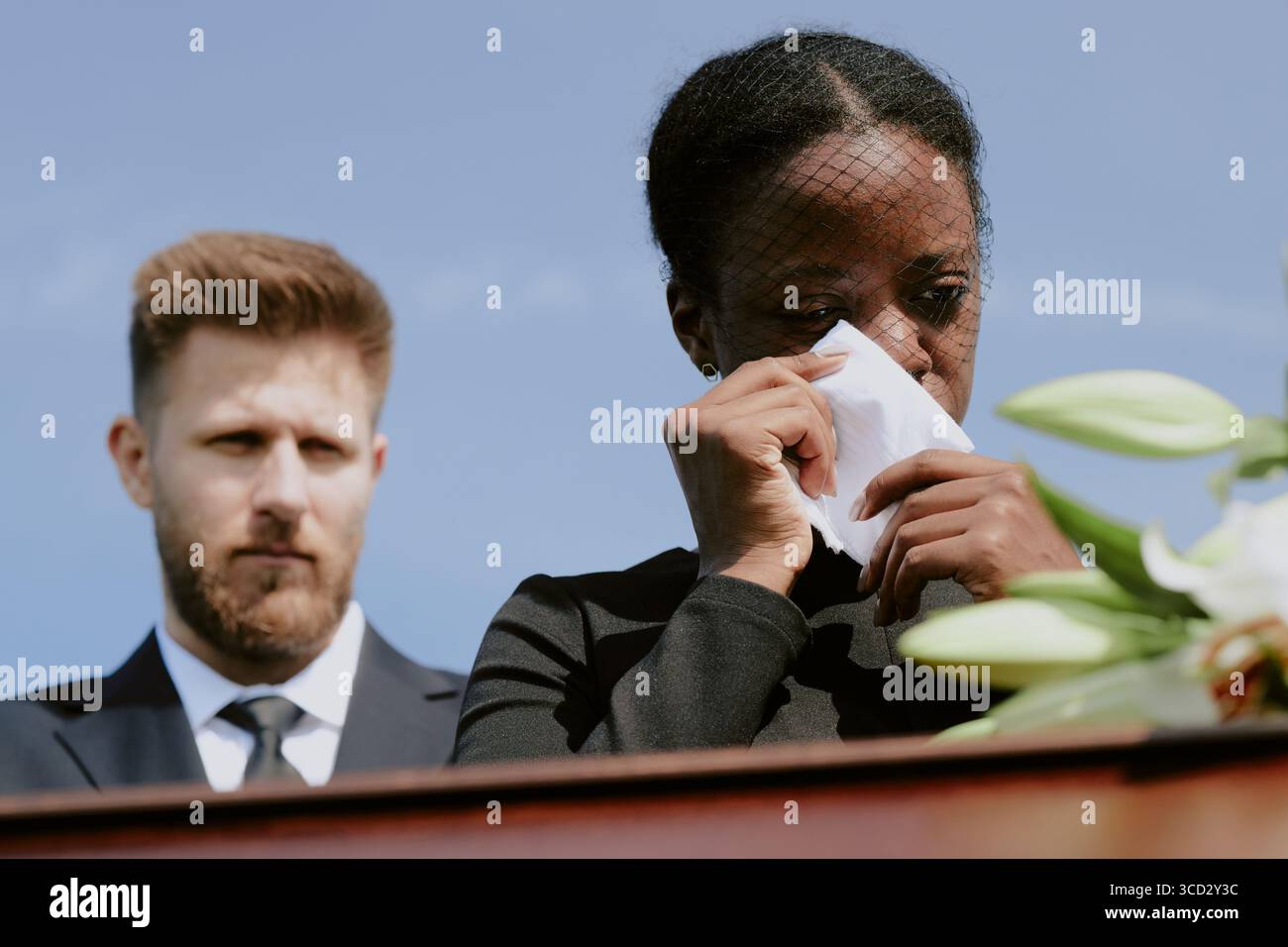 Woman cry during funeral hi-res stock photography and images - Alamy