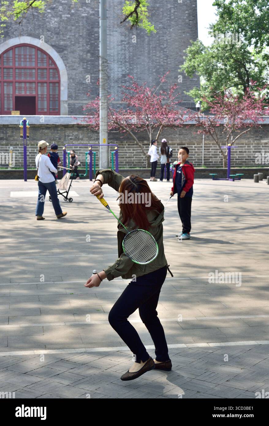 People playing badminton in a park between Drum and Bell towers in ...