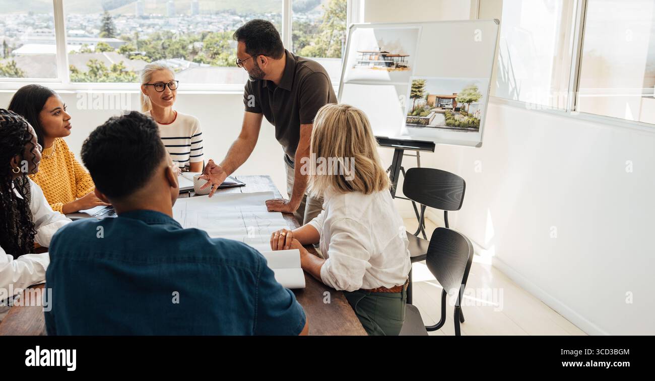 A group of diverse architects, male and female, collaborating on design ...