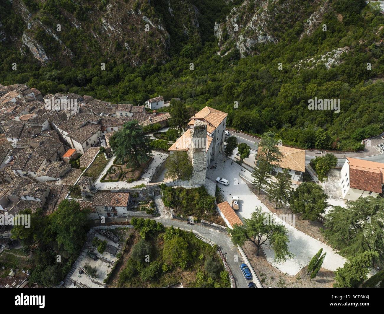 Aerial view of ancient stone buildings nestled amidst verdant hills ...