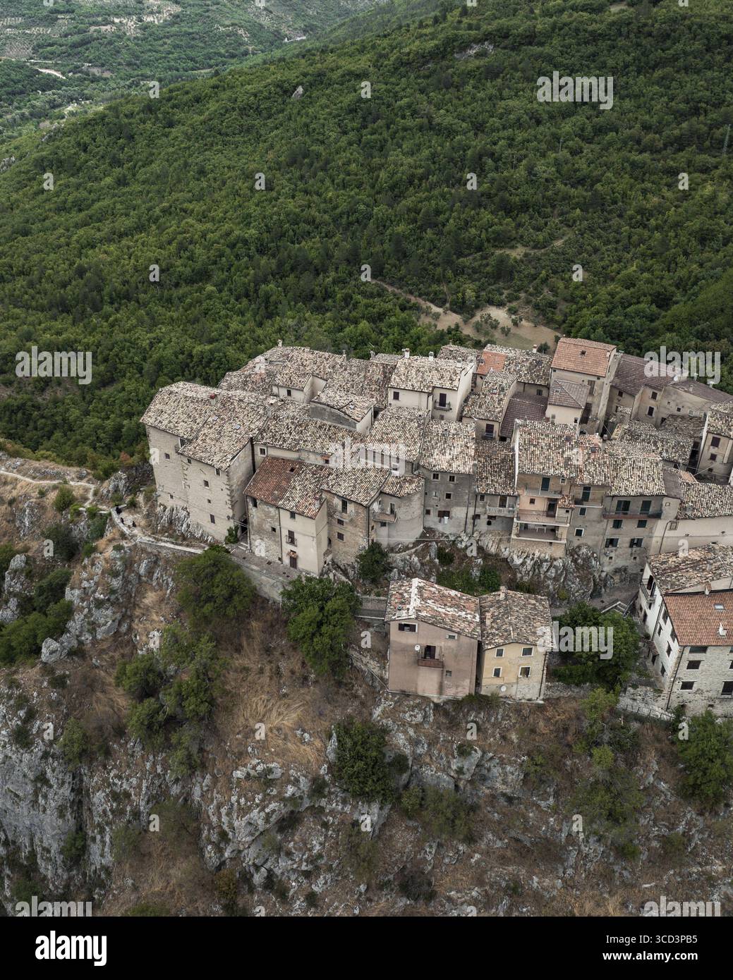 Aerial view of ancient stone buildings clustered atop a rocky ...