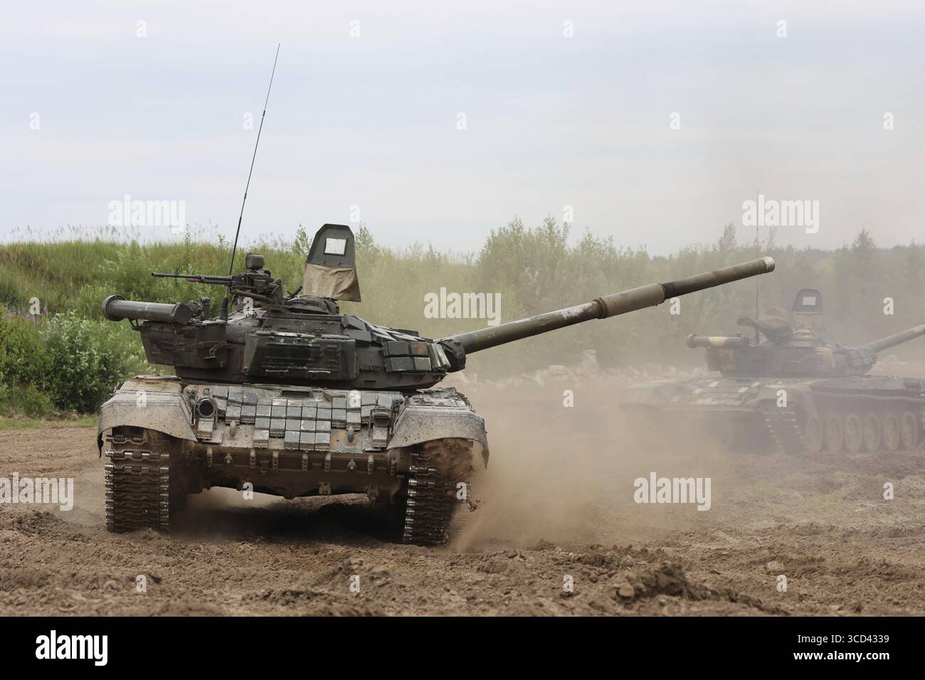 Powerful heavy fighting vehicle tank rides through the range during ...
