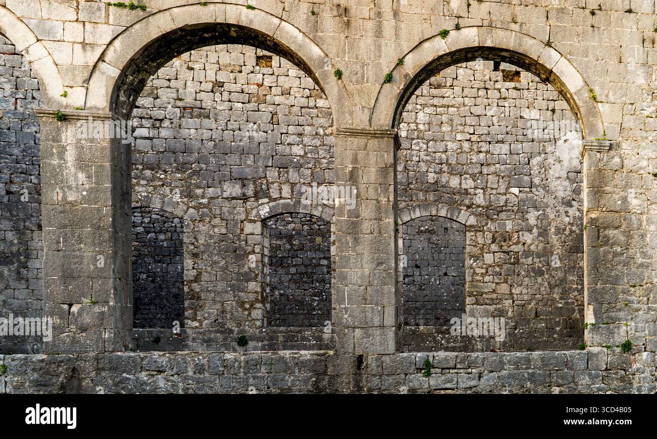 Stone arches and bricked windows on an ancient wall Stock Photo - Alamy