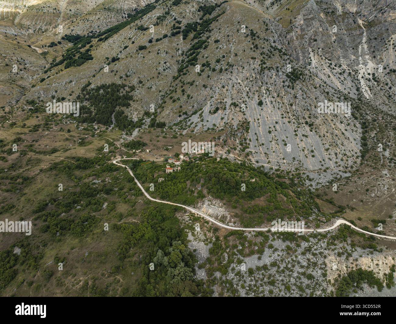 Aerial view of the winding path leading to the village nestled amidst ...