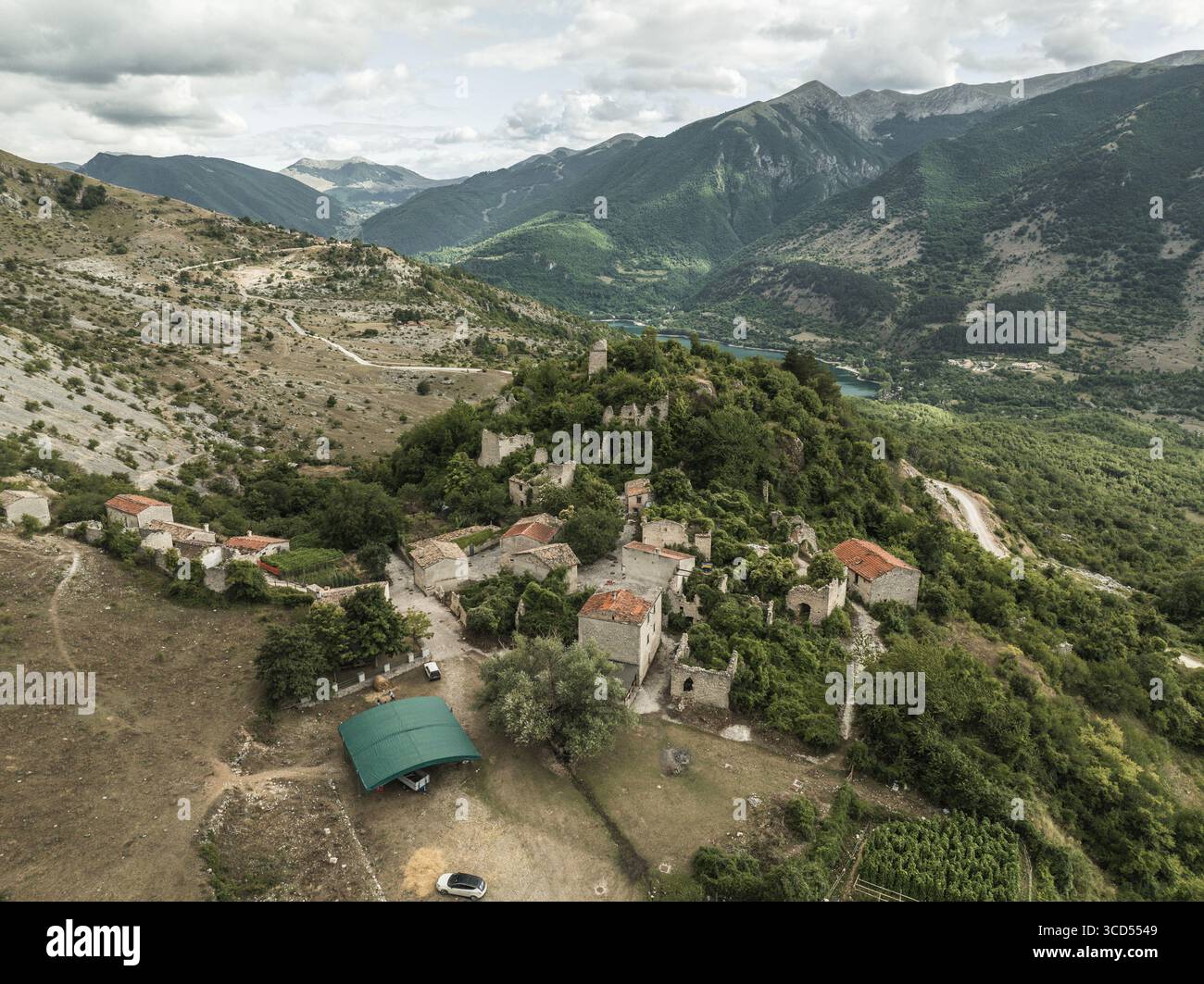 Aerial view of ancient stone buildings nestled amongst vibrant green ...