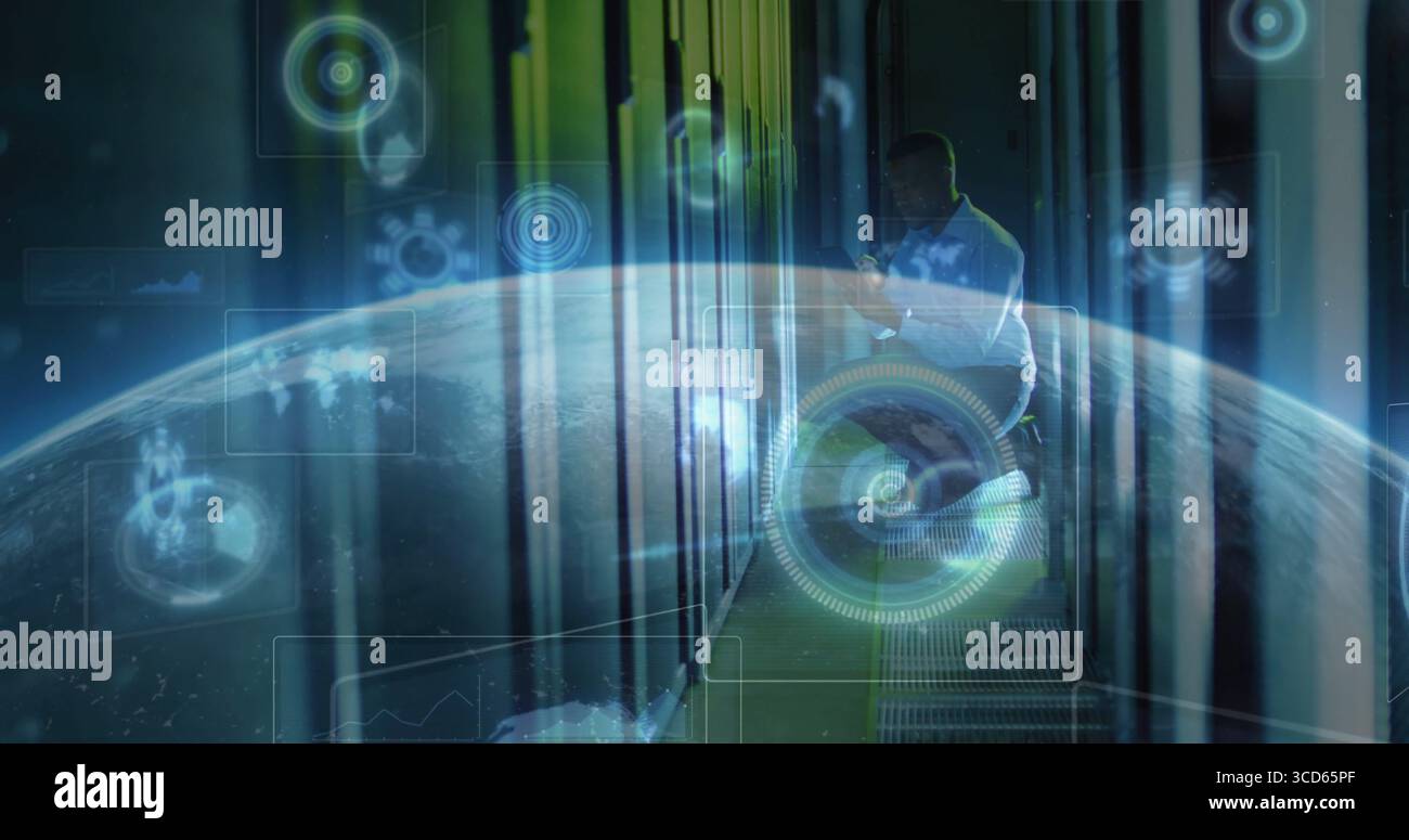 Crouching tech adjusting rack panel in data center corridor, using ...