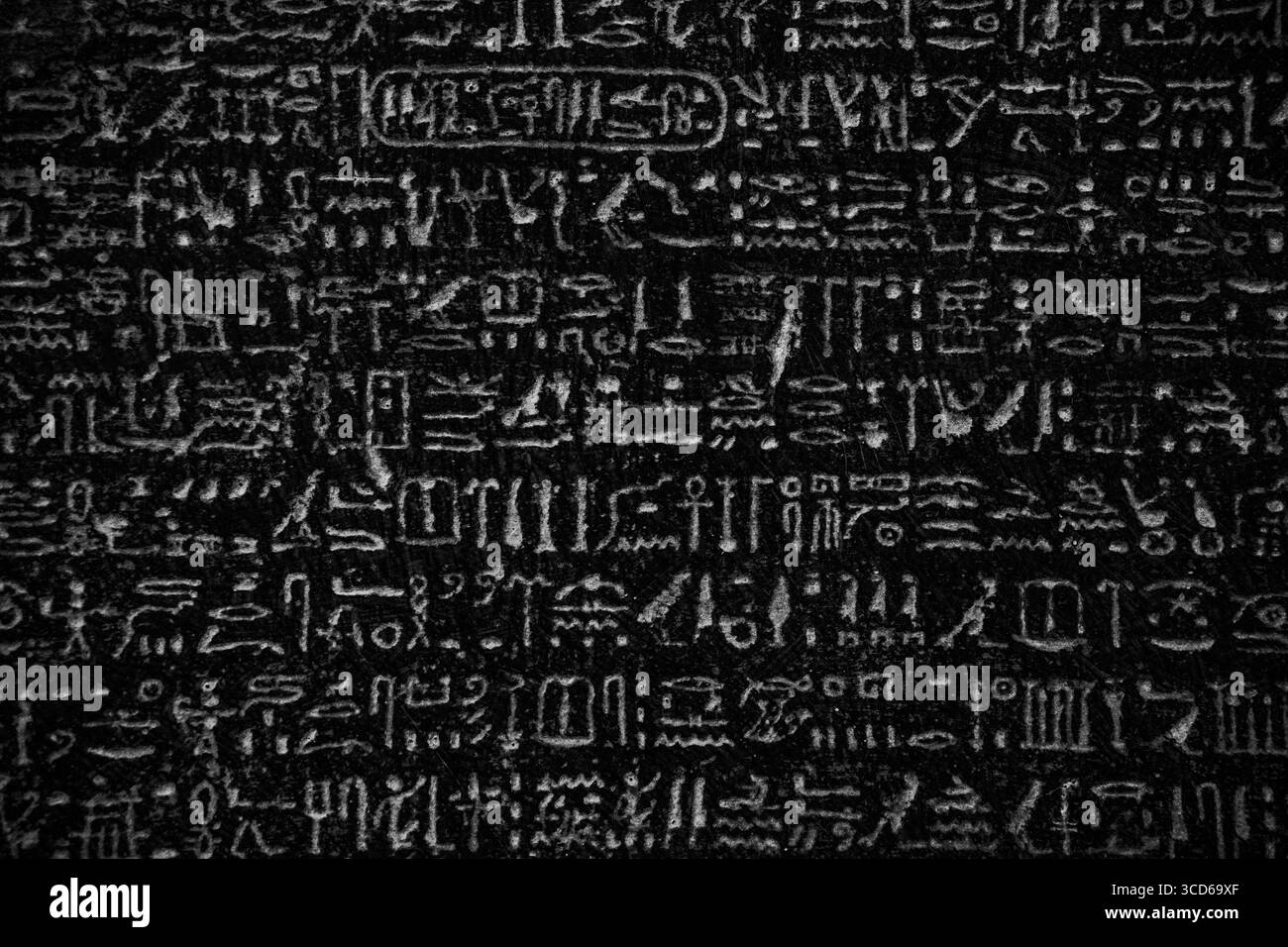 Egyptian hieroglyphs stone background Black and White Stock Photos ...