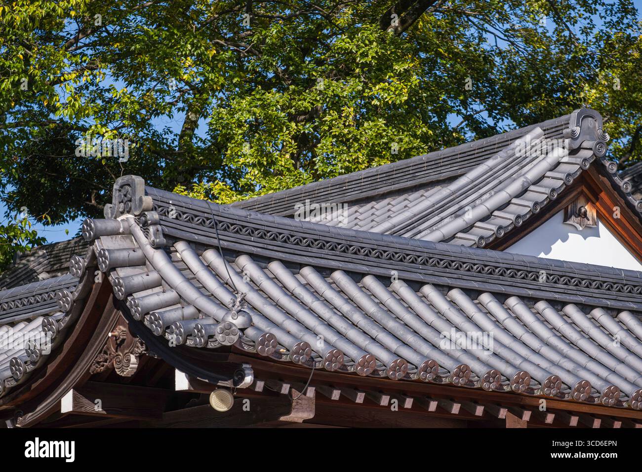 Traditional Japanese tiled roof on the grounds of Tenmangu Shrine ...