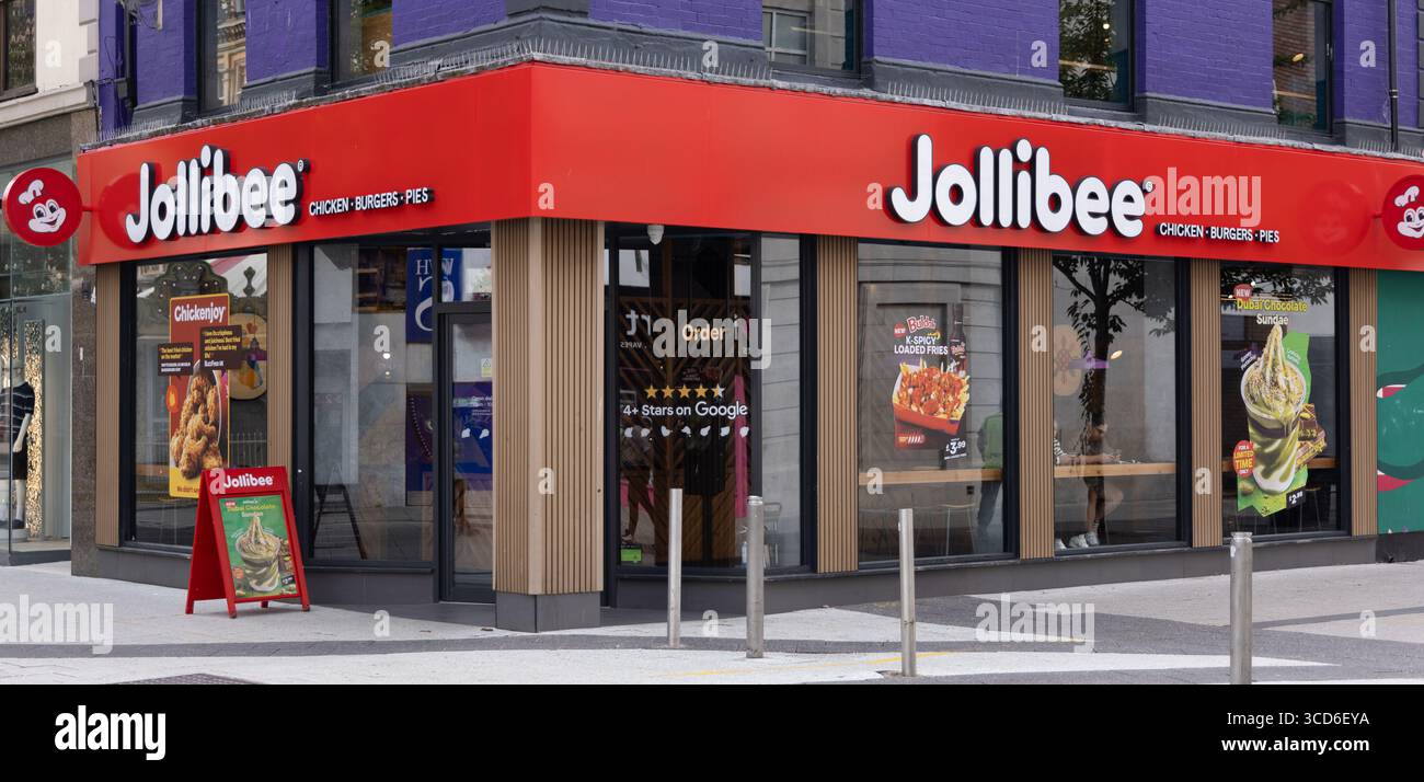 CARDIFF, UK - AUGUST 8, 2025 - Exterior view of a Jollibee restaurant ...